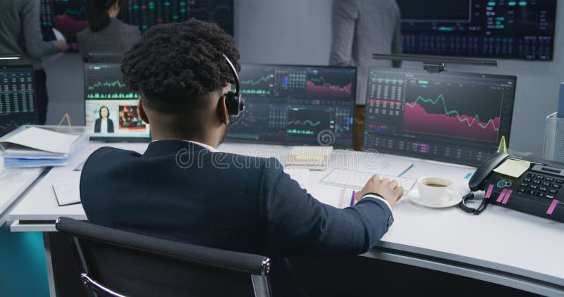 African American Trader Analyzes Market Charts Stock Photo - Image of ...