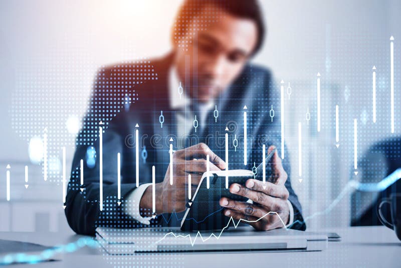 African American Trader Wearing Formal Suit is Sitting at Workplace ...