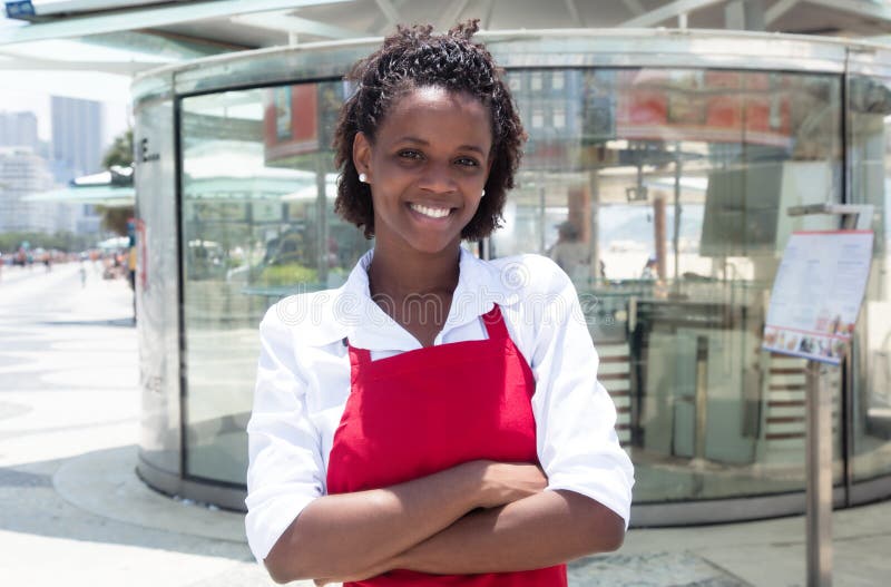 African American Waitress in Front of the Restaurant Stock Photo ...
