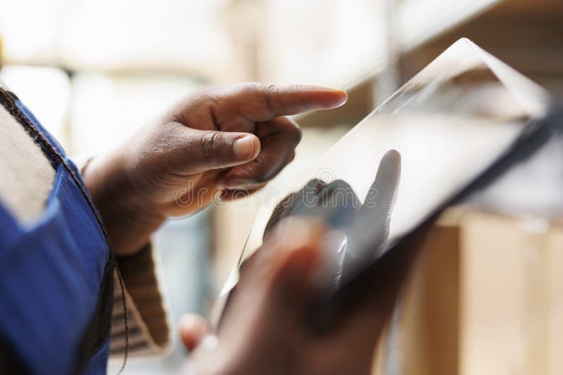African American Warehouse Worker Hand Tapping on Tablet Screen Stock ... African American Warehouse Worker Hand Tapping on Tablet Screen Stock ...