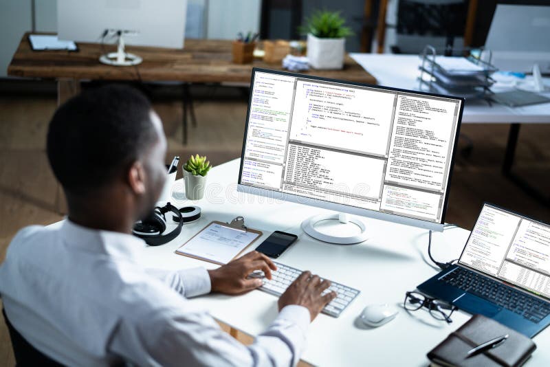 African Coder Using Multiple Computer Screens Stock Photo - Image of ... African Coder Using Multiple Computer Screens Stock Photo - Image of ...