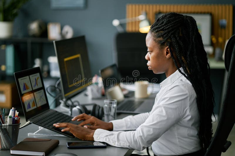 African American Woman Analyzing Data on Computer Screen Stock Image ...