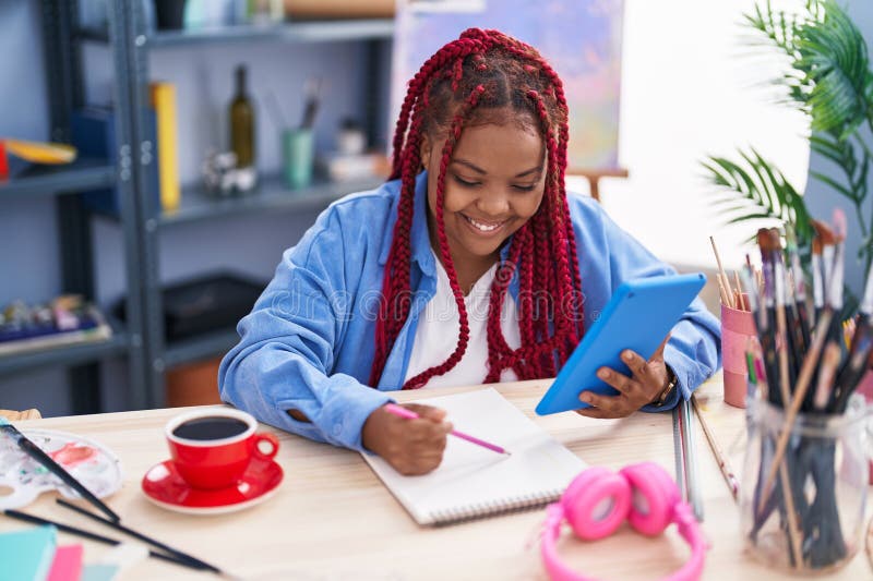 African American Woman Artist Using Touchpad Drawing on Notebook at Art ...