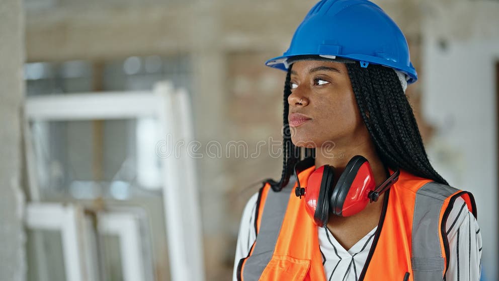 African American Woman Builder Standing with Relaxed Expression at ...