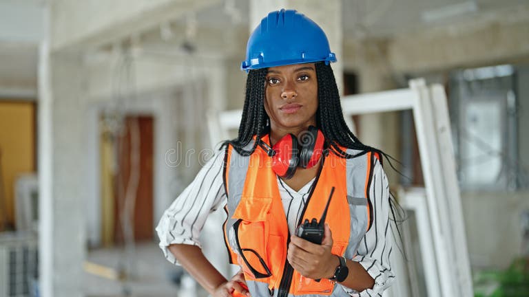 African American Woman Builder Standing with Relaxed Expression at ...