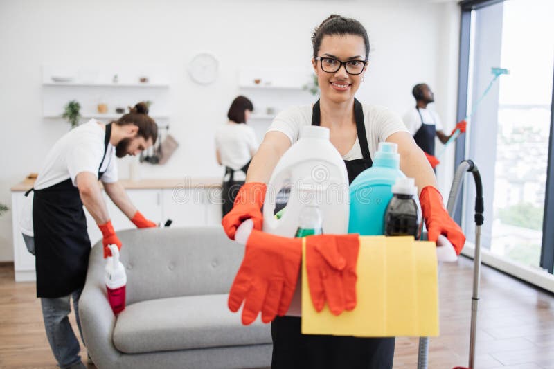 African American Woman Cleaning Worker Holding A Bucket With Detergents