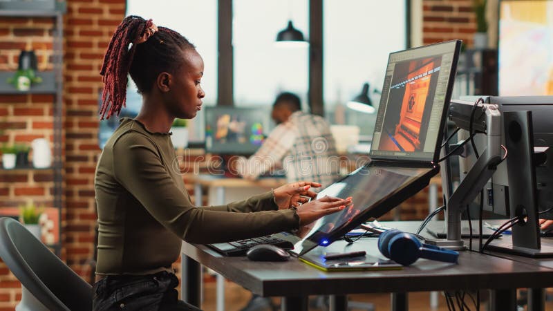 African American Woman Designing Game Interface on Computer Stock Photo ...