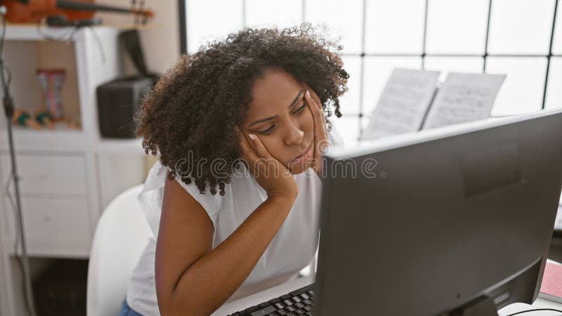 African American Woman Feeling Stressed in a Music Studio Stock Image ...
