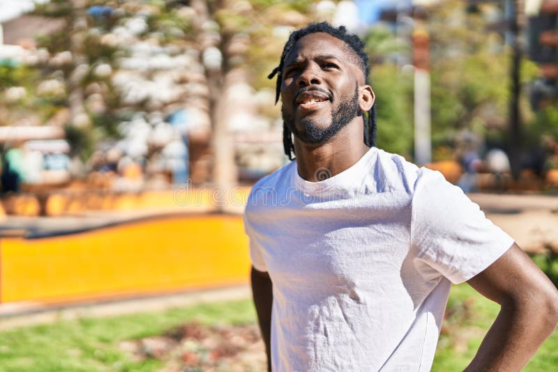 African American Woman with Relaxed Expression Standing at Park Stock ...