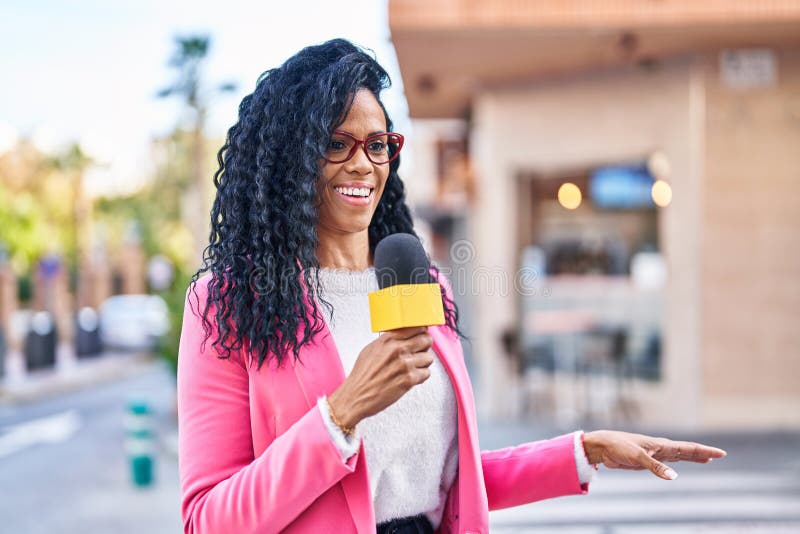 African American Woman Reporter Working Using Microphone At Street