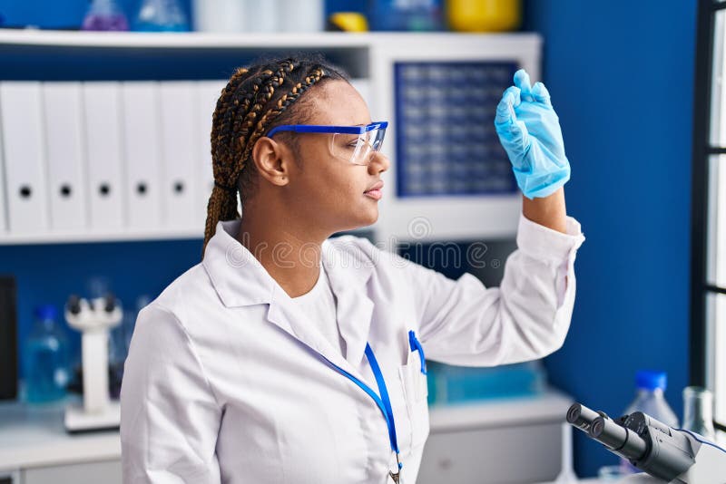 African American Woman Scientist Looking Sample at Laboratory Stock ...