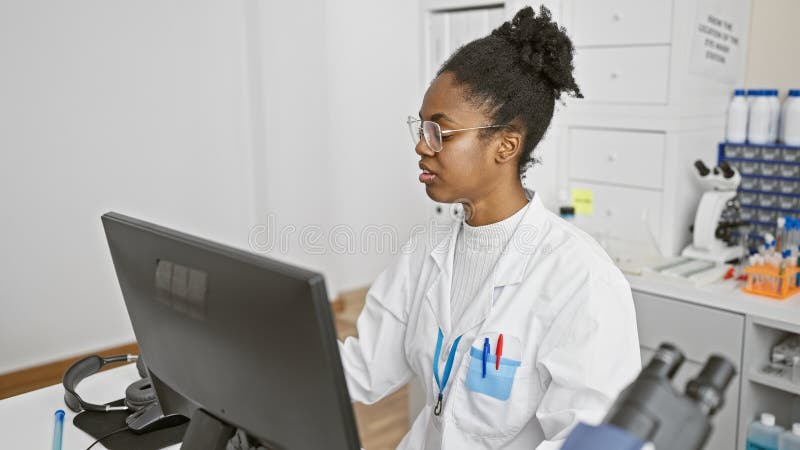 African American Woman Scientist Working on Computer in Laboratory ...
