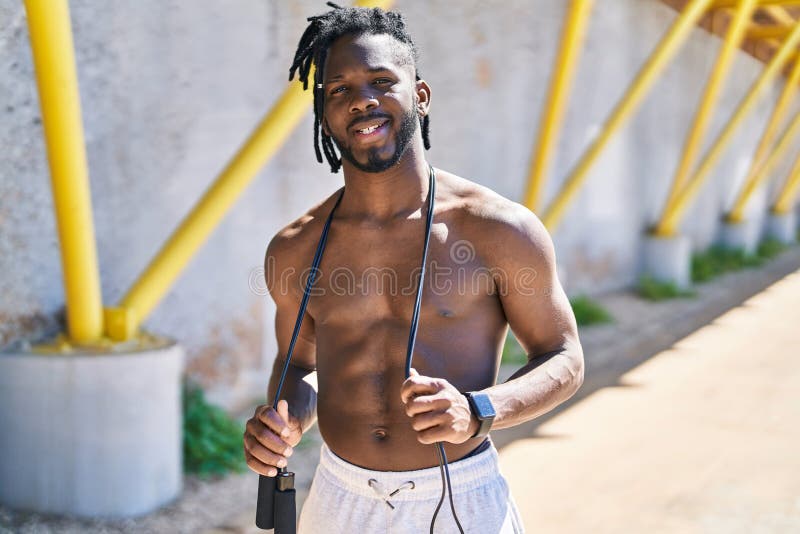 African American Woman Shirtless Smiling Confident Holding Rope at ... African American Woman Shirtless Smiling Confident Holding Rope at ...