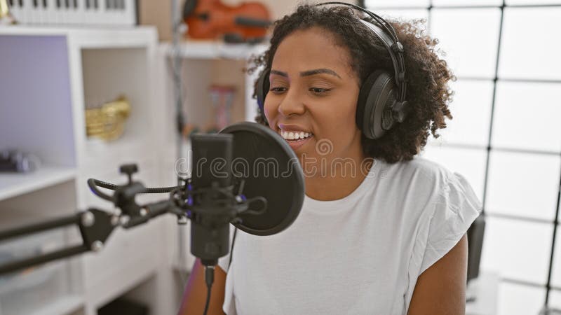 African American Woman Singing in Music Studio Stock Image - Image of ...