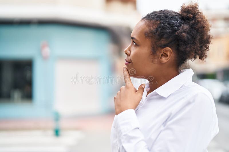 African American Woman Standing with Doubt Expression at Street Stock ...