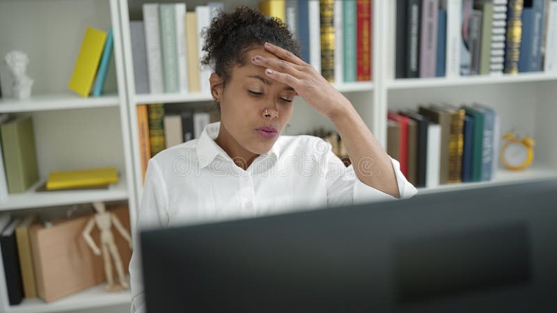 African American Woman Student Using Computer Stressed at Library ...
