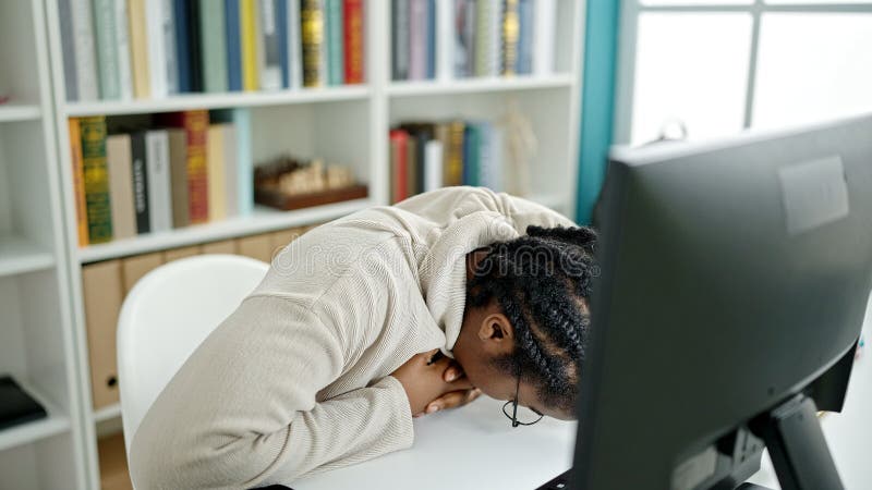 African American Woman Student Using Computer Stressed at Library ...
