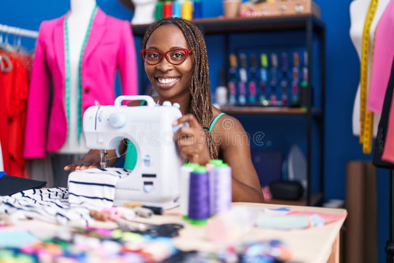 African American Woman Tailor Smiling Confident Using Sewing Machine at ...