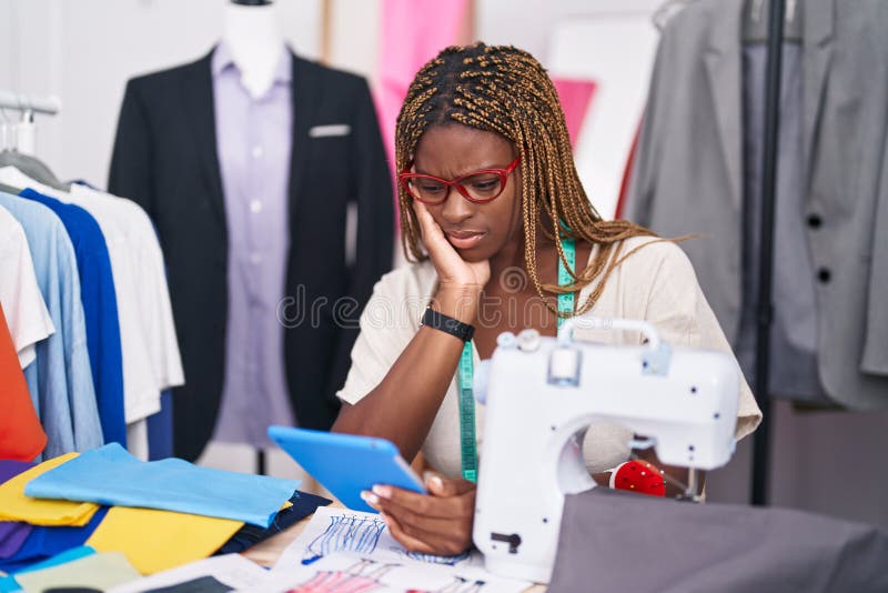 African American Woman Tailor Stressed Using Touchpad at Tailor Shop ...