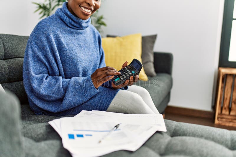 African American Woman Using Calculator Accounting at Home Stock Image ...