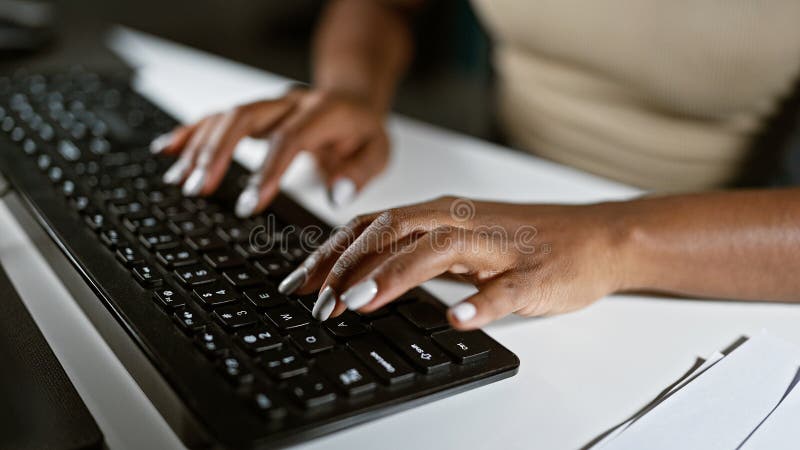 African American Woman Using Computer Typing on Keyboard at the Office ...