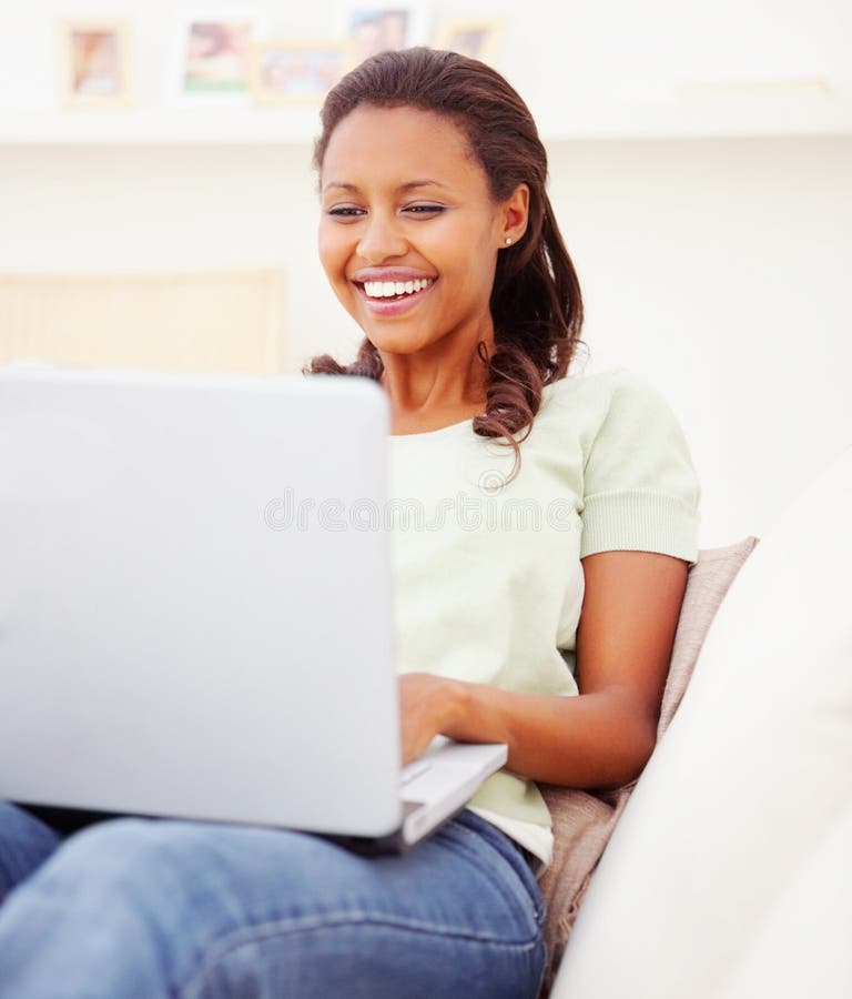 African American Woman Using a Laptop at Home Stock Image - Image of ...