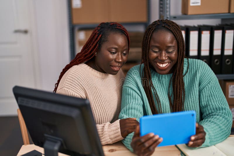 African American Women Ecommerce Business Workers Using Touchpad ...