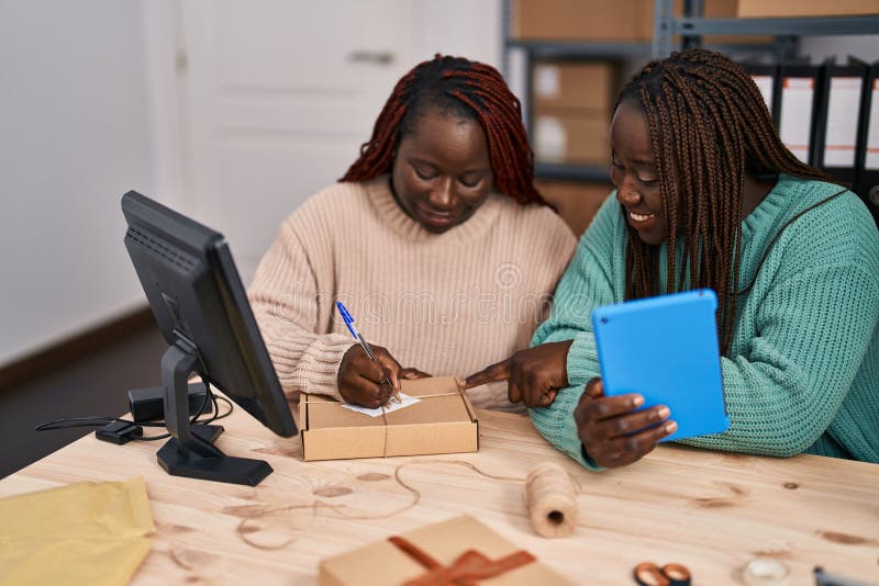 African American Women Ecommerce Business Workers Using Touchpad ...