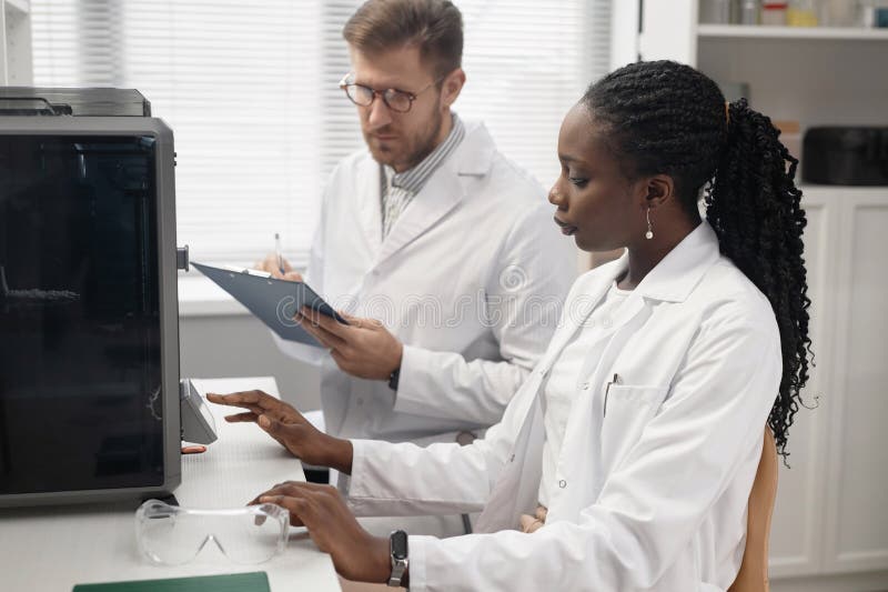 Female Engineer Preparing Enclosed 3D Printer for Work Stock Photo ...