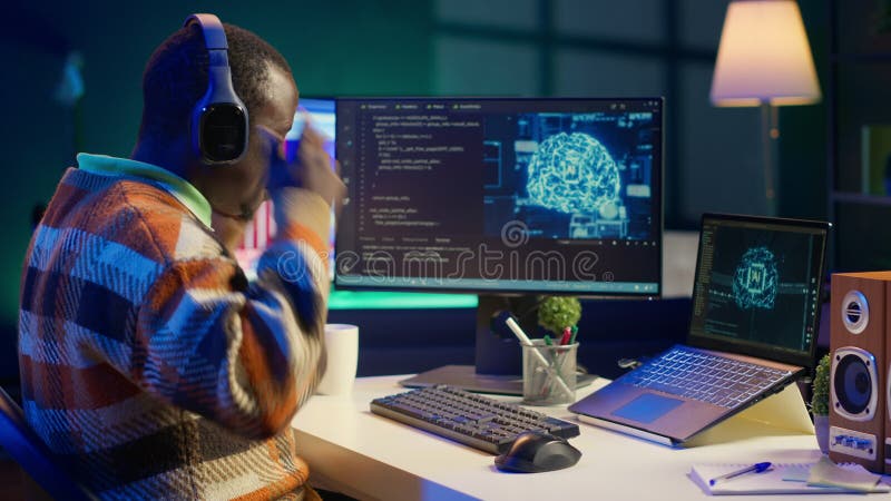 African American Worker at Desk Using Personal Computer for Programming ...