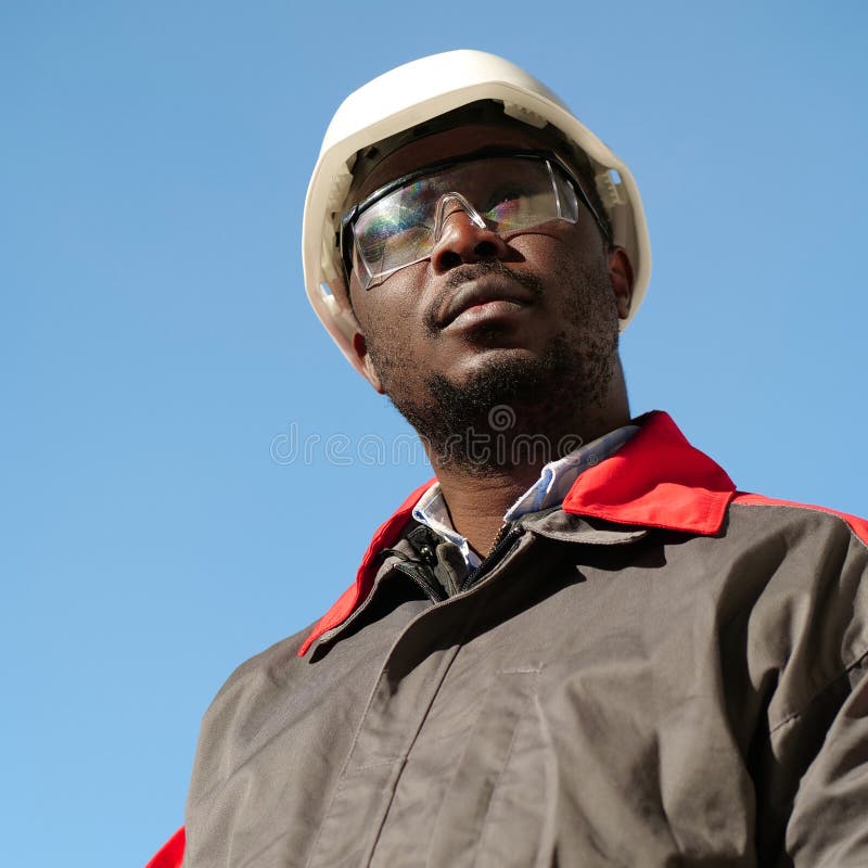 African American Worker Stands at Construction Site Stock Photo - Image ...
