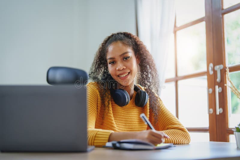 African American Using Computers and Notebooks Online Stock Photo ...
