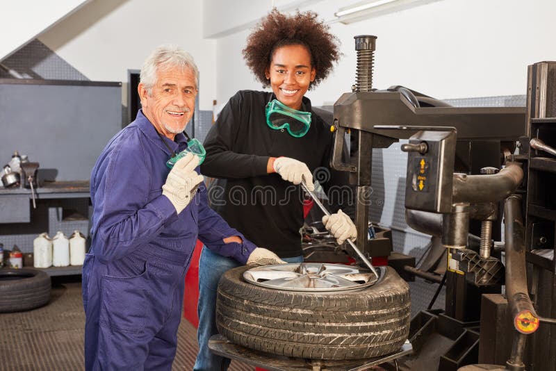 African Apprentice and Master in Auto Repair Shop Stock Image - Image ...