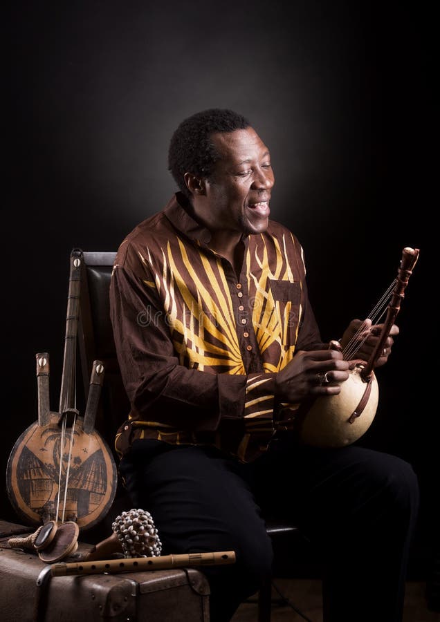 African Black Man With Ethnic Musical Instrument Stock Image - Image of ...