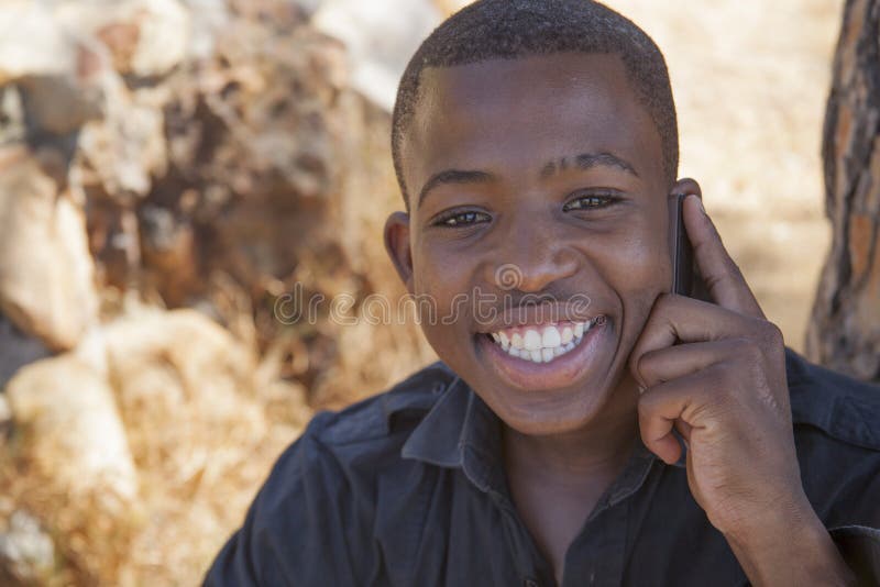 African boy on cell phone stock photo. Image of outside - 28713196