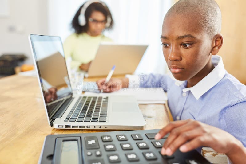 African Boy at Laptop Computer while Homeschooling Stock Photo - Image ...