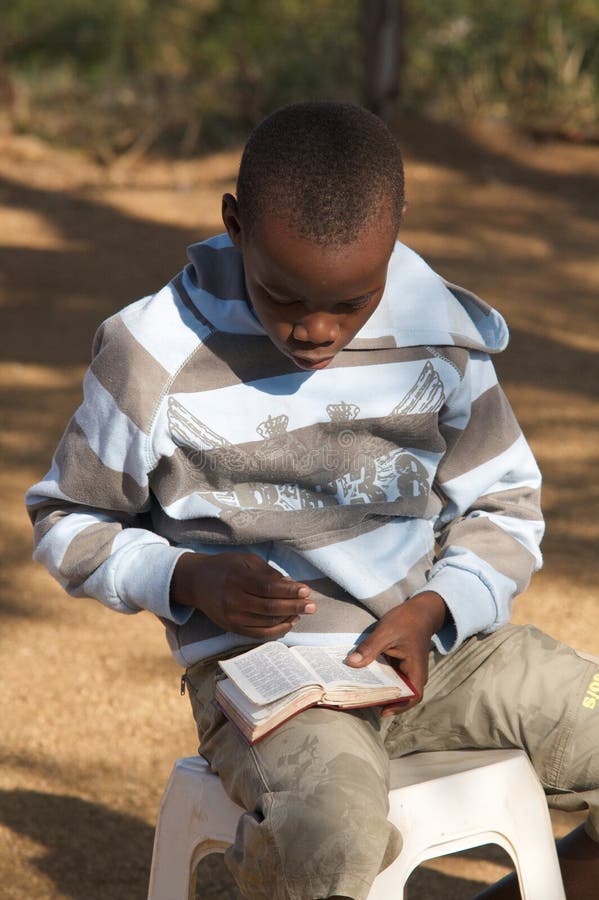 African Boy Reading His Bible Editorial Photo - Image of nose, african ...
