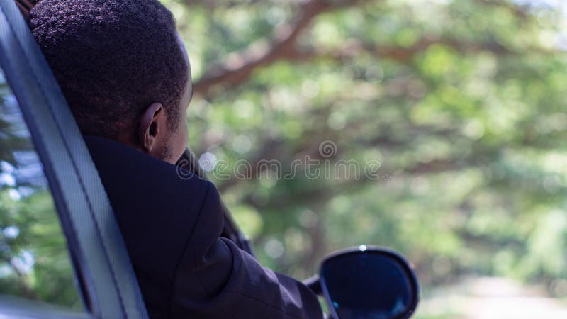 African Business Man Driving and Sitting in a Car with Open Front ...