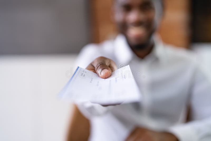 African Business Man Giving Paycheck Stock Photo - Image of payroll ...
