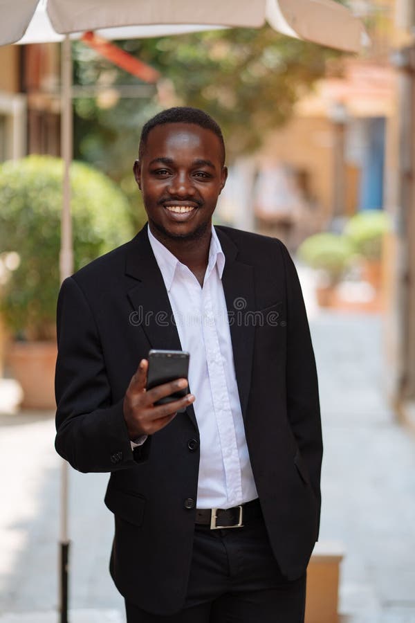 African Business Man Using His Smartphone in the City Stock Photo ...