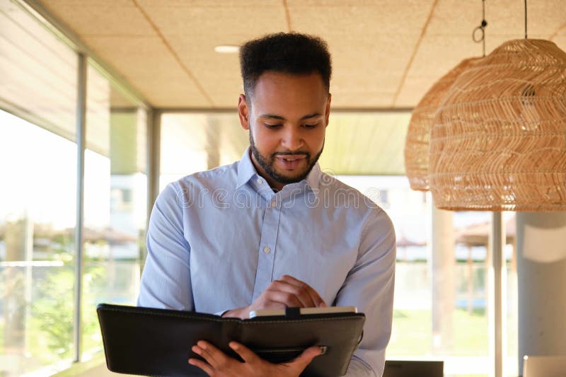 African Business Man Working at a Coworking Office. Stock Image - Image ...
