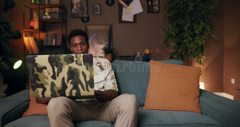 An African Call Center Worker Using a Headset and a Copy Machine in a ...