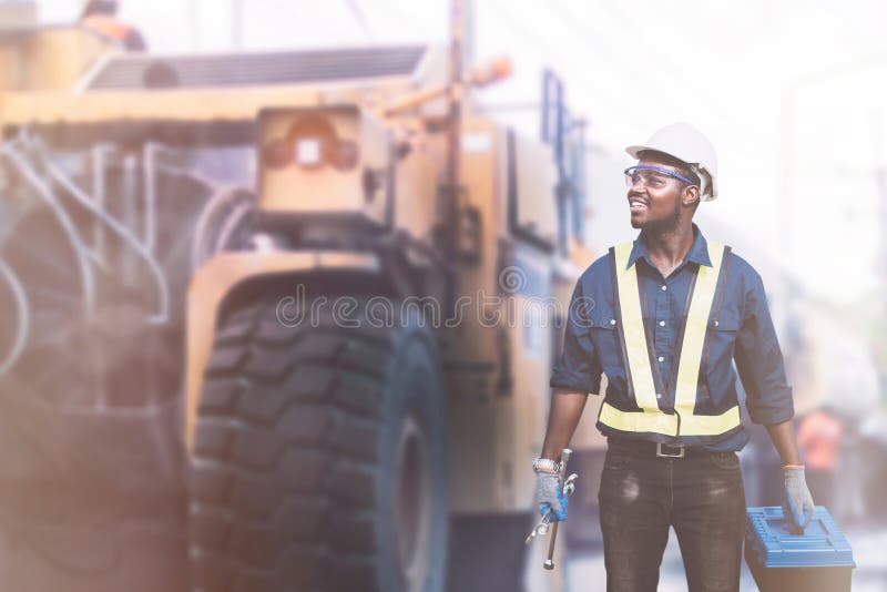 African Civil Engineering Standing Against the Truck with Holding Tool ...