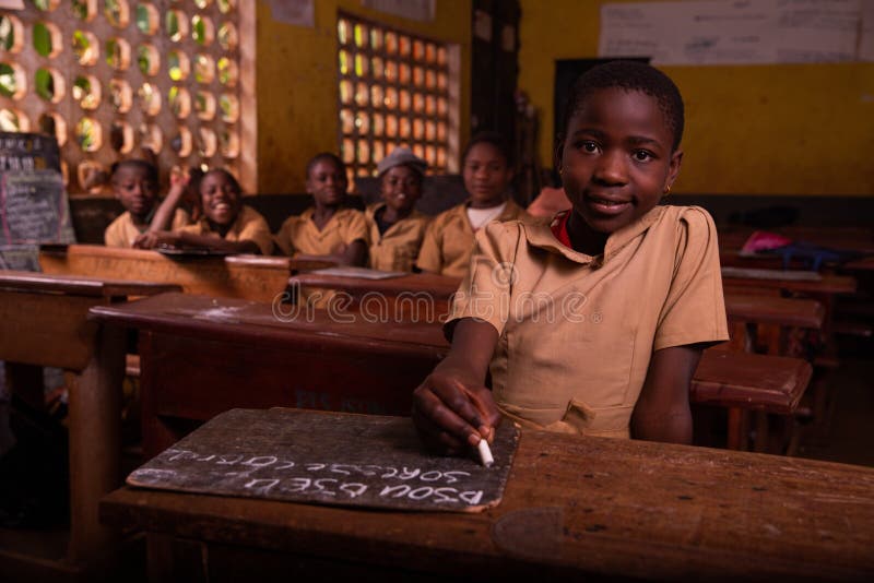 In an African Classroom Full of Black Children Intent on Learning ...