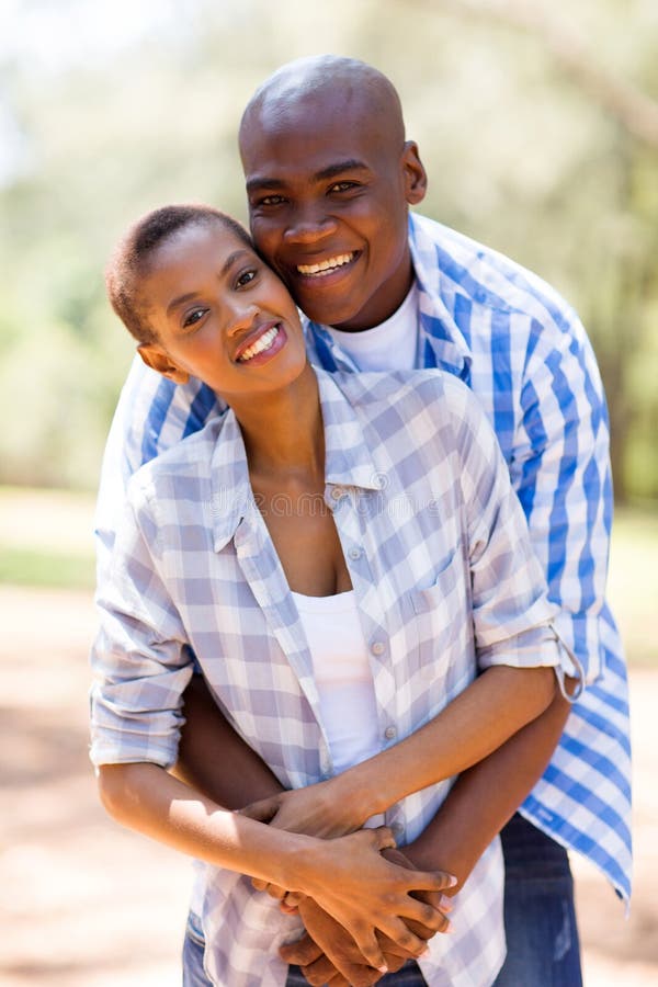 African couple embracing stock photo. Image of cheerful - 49079454