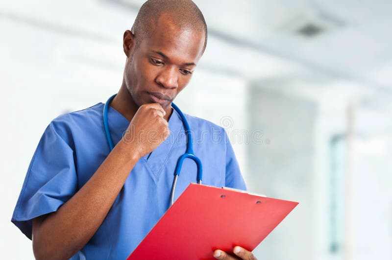 African Doctor Reading Clipboard Stock Image - Image of american ...