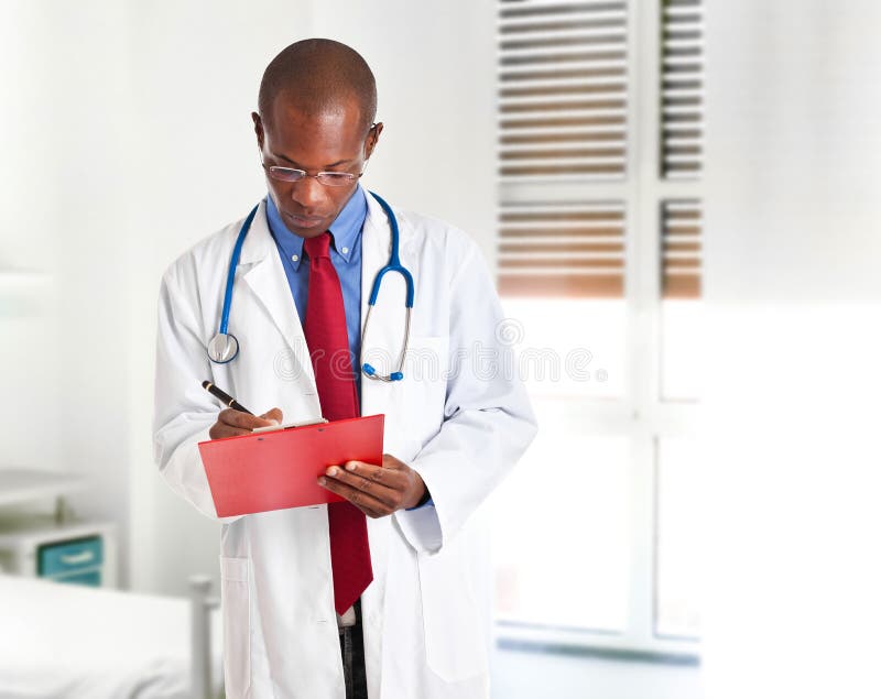 African Doctor Reading Clipboard Stock Photo - Image of hospital ...
