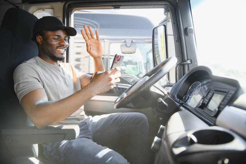African Driver in the Cabin of a Truck Talking on the Phone Stock Photo ...