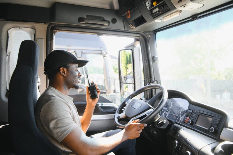 AFrican Driver Using Walkie Talkie in Cab of Modern Truck Stock Image ...