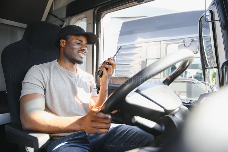 African Driver in the Cabin of a Truck Talking on the Phone Stock Photo ...